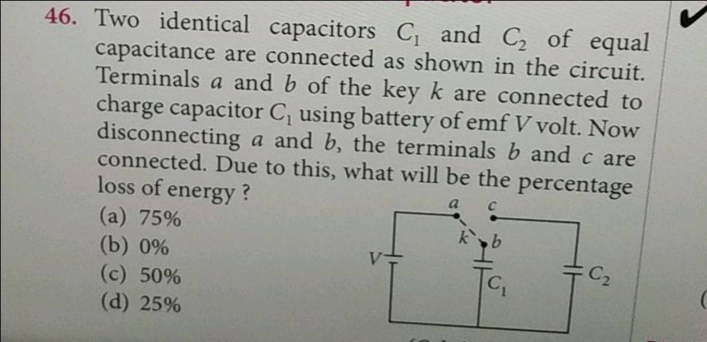 Two identical capacitors C1 and C2 of equal capacitance are connected a..