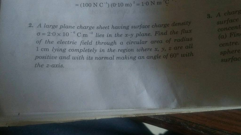 2. A large plane charge sheet having surface charge density sigma=2cdot0i..