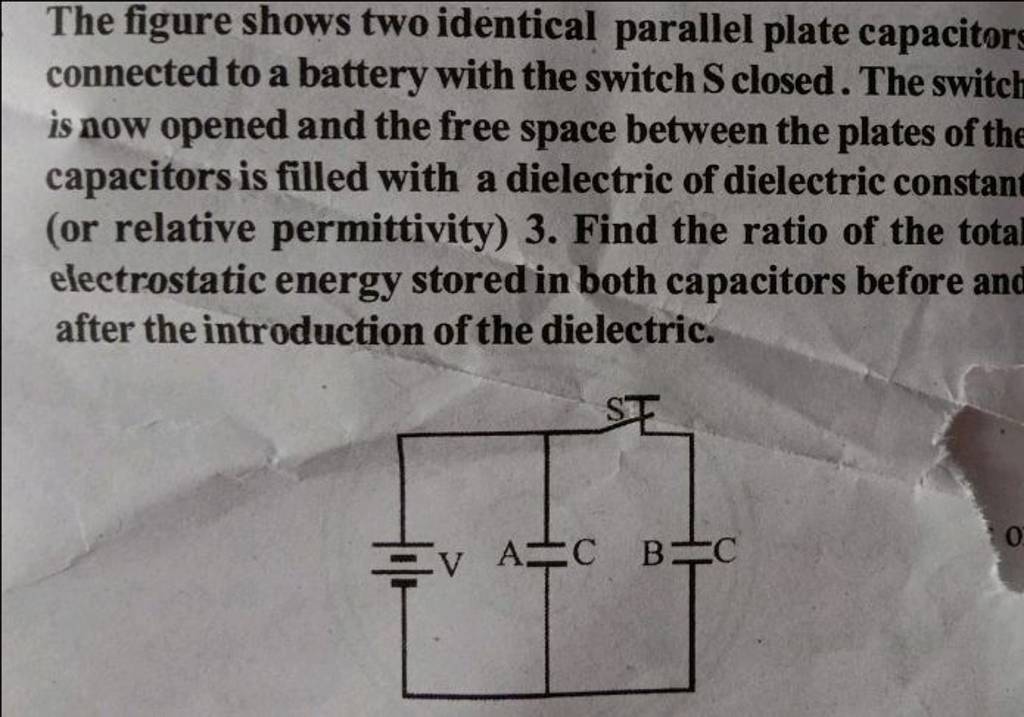 The figure shows two identical parallel plate capacitor connected to a ba.. The figure shows two identical parallel plate capacitor connected to a ba..