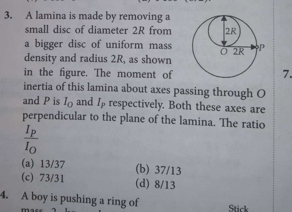 A lamina is made by removing a small disc of diameter 2R from a bigger di..