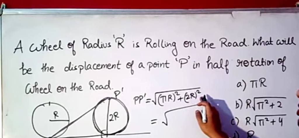 A wheel of Radius R is Rolling on the Road. What will be the displaceme..