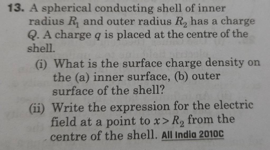 13. A spherical conducting shell of inner radius R1 and outer radius R2