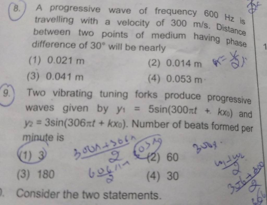 Two vibrating tuning forks produce progressive waves given by y1 =5sin(30..