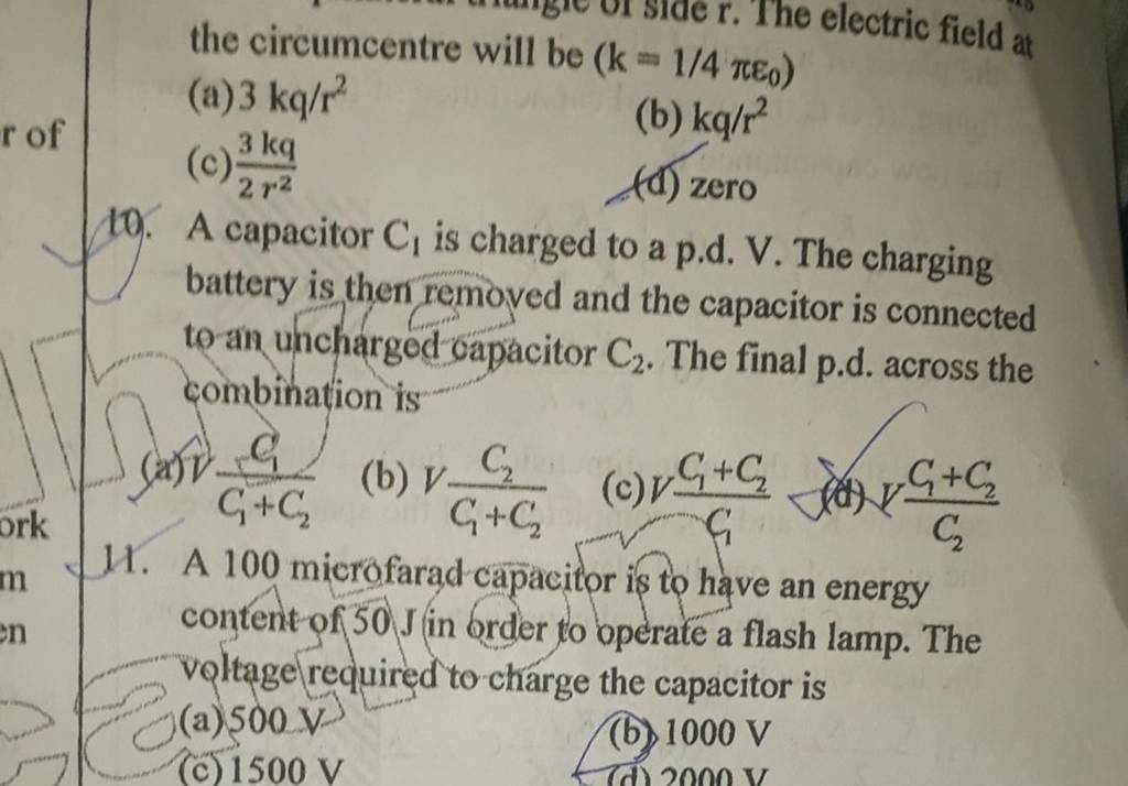 A 100 microfarad capacitor is to have an energy content of 50 J in brder
