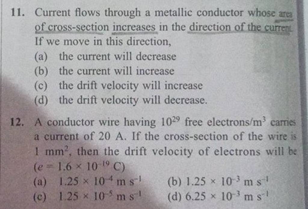 Current flows through a metallic conductor whose are of cross-section inc..