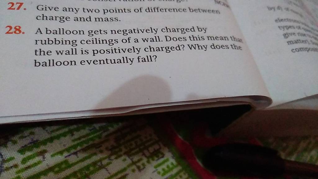 27. Give any two points of difference between charge and mass. 28. A ball..