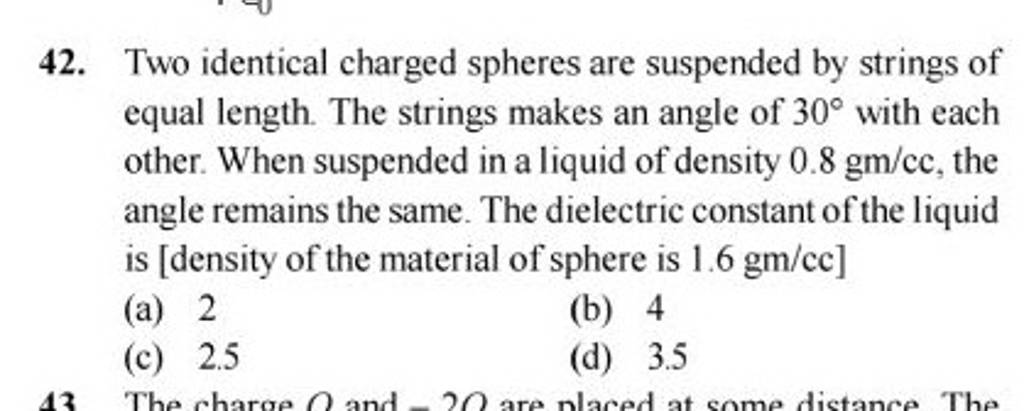 Two identical charged spheres are suspended by strings of equal length. T..