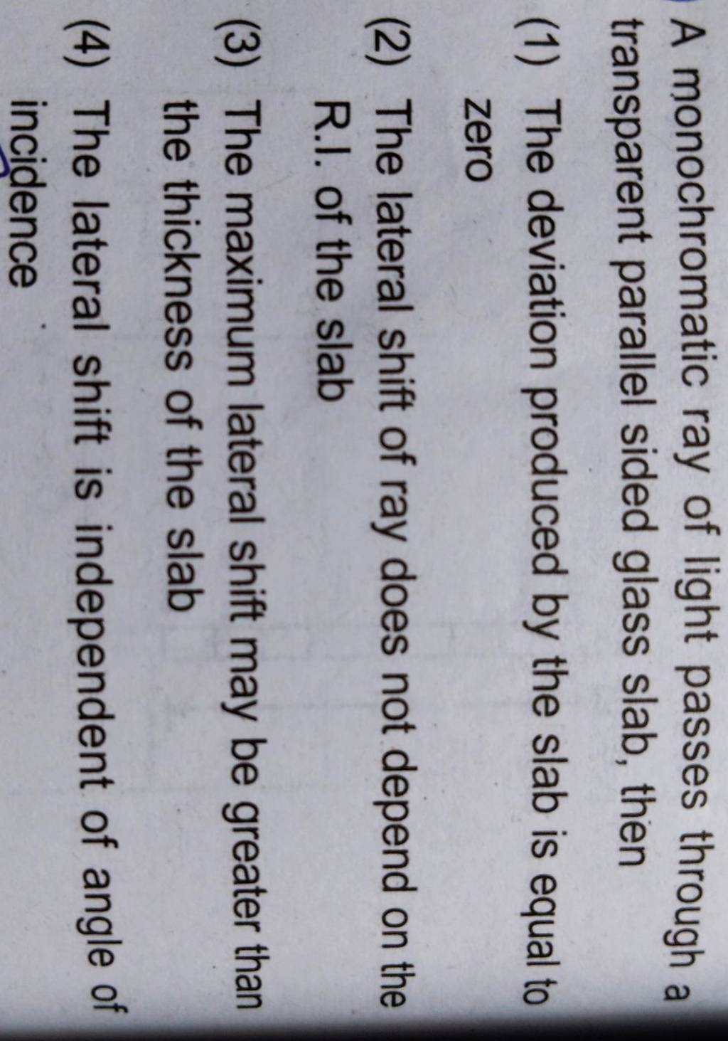 A monochromatic ray of light passes through a transparent parallel sided