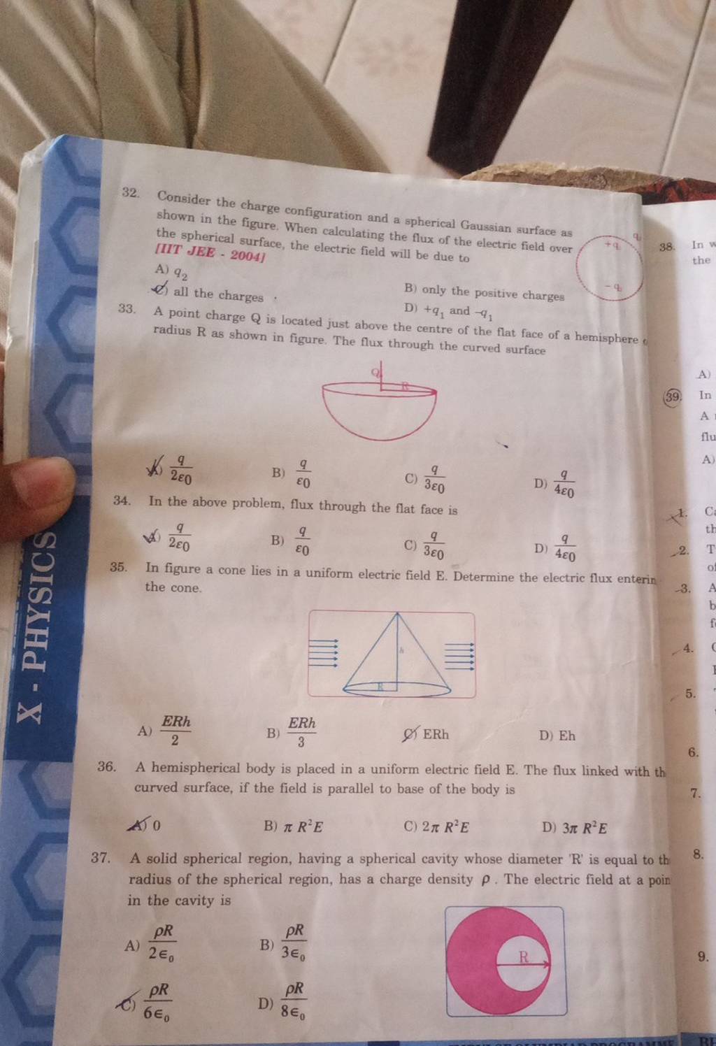 A hemispherical body is placed in a uniform electric field E. The flux li..