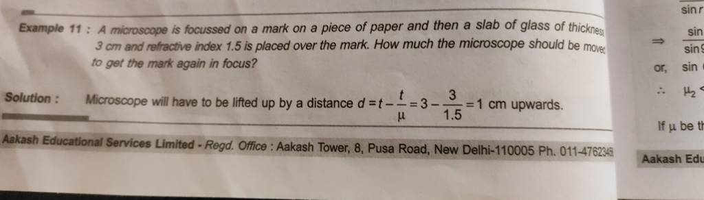 Example 11: A microscope is focussed on a mark on a piece of paper and th..