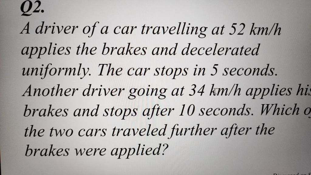 Q2. A driver of a car travelling at 52 km/h applies the brakes and decele..