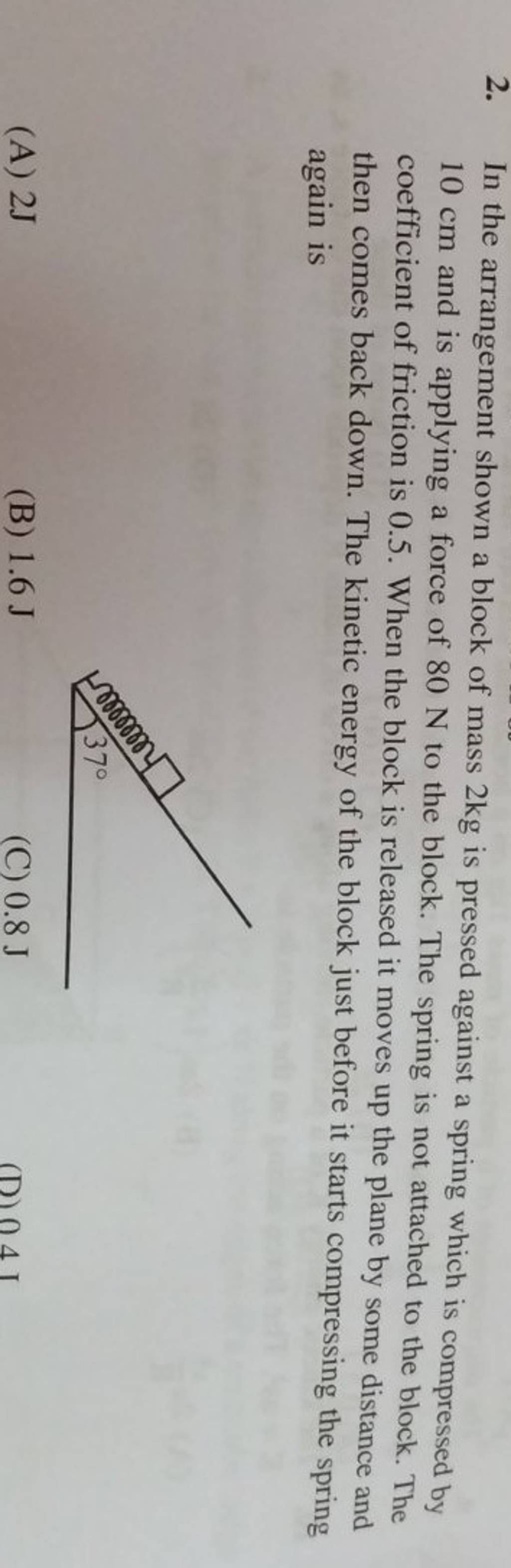 2. In the arrangement shown a block of mass 2 kg is pressed against a spr.. 2. In the arrangement shown a block of mass 2 kg is pressed against a spr..