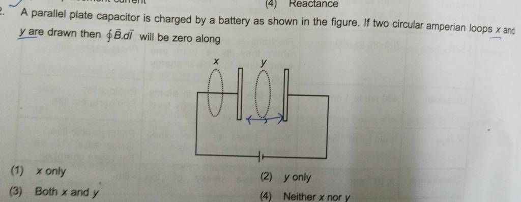 A parallel plate capacitor is charged by a battery as shown in the figure..