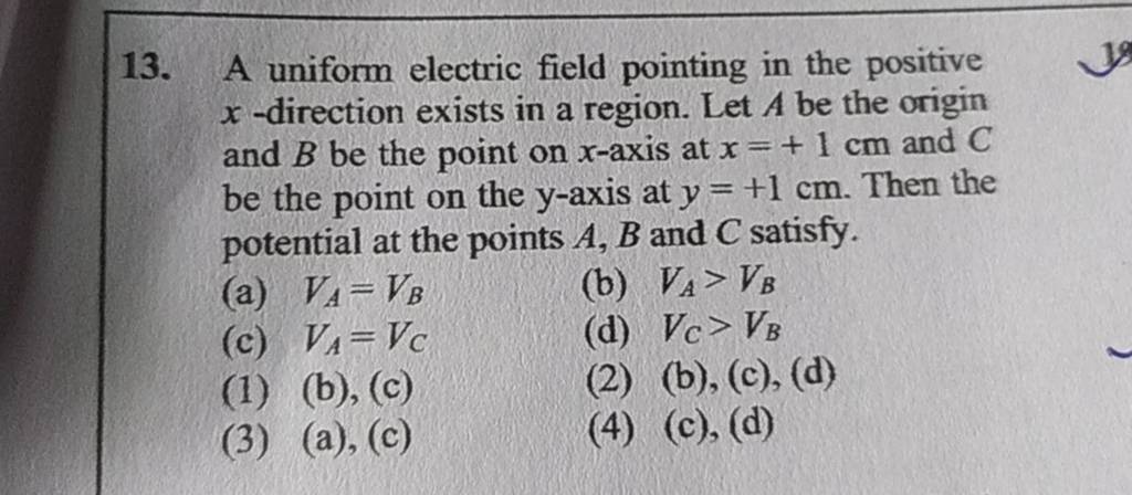 A uniform electric field pointing in the positive x-direction exists in a..