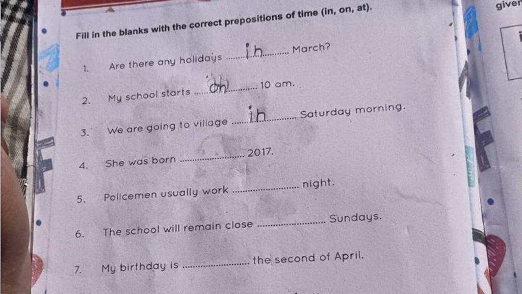 Fill in the blanks with the correct prepositions of time (in, on, at)...