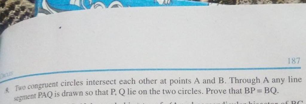9. Two congruent circles intersect each other at points A and B. Through