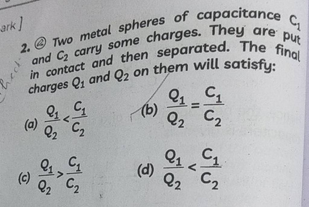 Two metal spheres of capacitance C1 and C2 carry some charges. They..