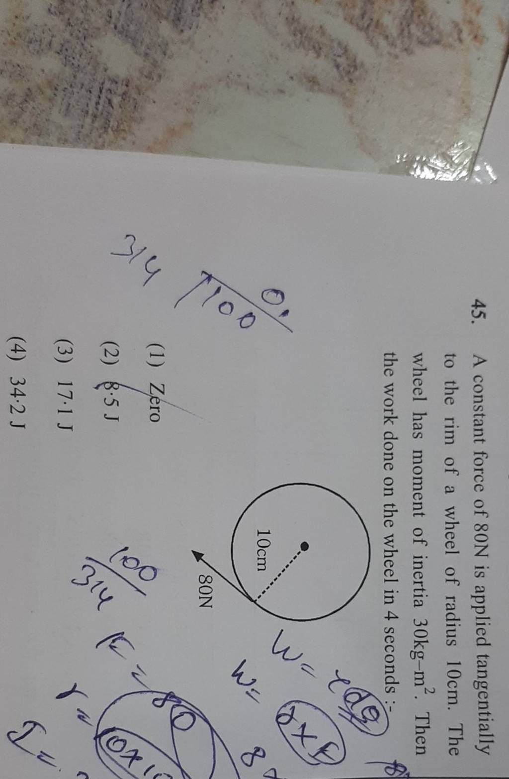 A constant force of 80 N is applied tangentially to the rim of a wheel of..