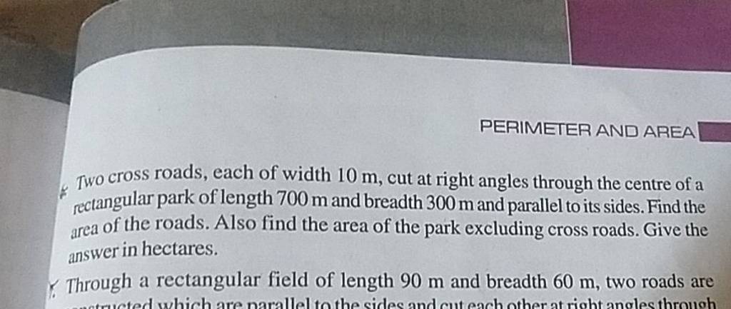 PERIMETER AND AREA \& Two cross roads, each of width 10 m, cut at right a..
