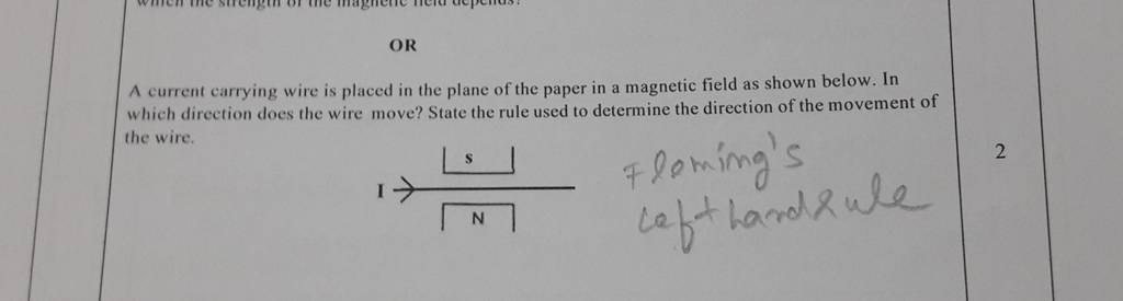 OR A current carrying wire is placed in the plane of the paper in a magne..