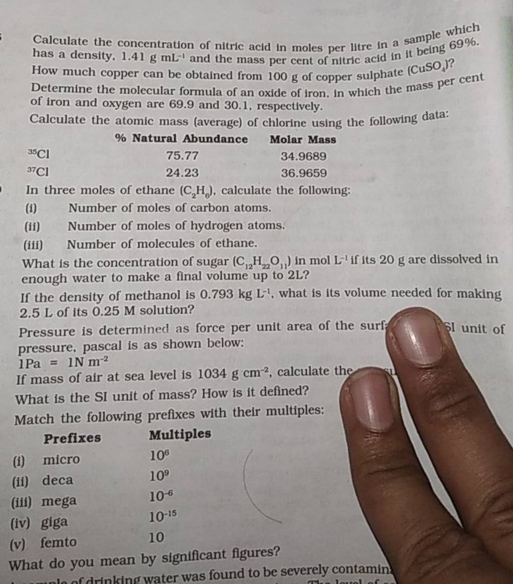 Calculate the concentration of nitric acid in moles per litre in a sample..