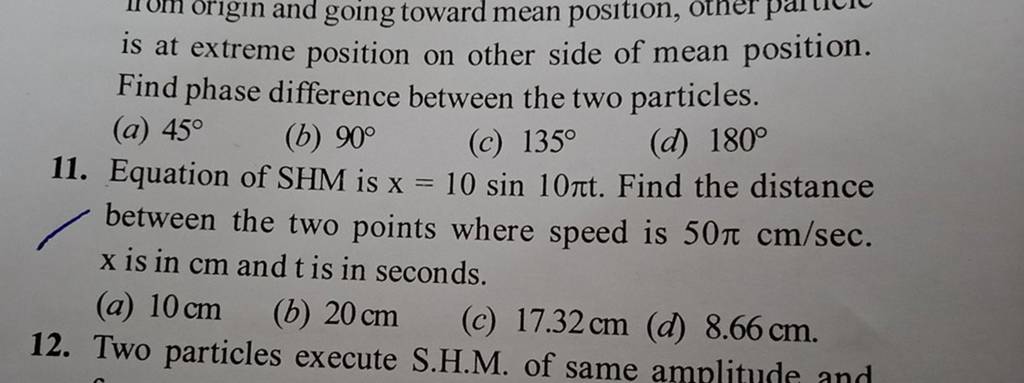 is at extreme position on other side of mean position. Find phase differe..