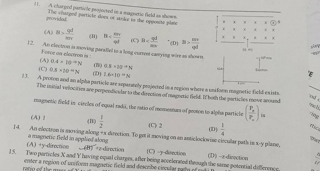 11. A charged particle projected in a magnetic field as shown. The charge..