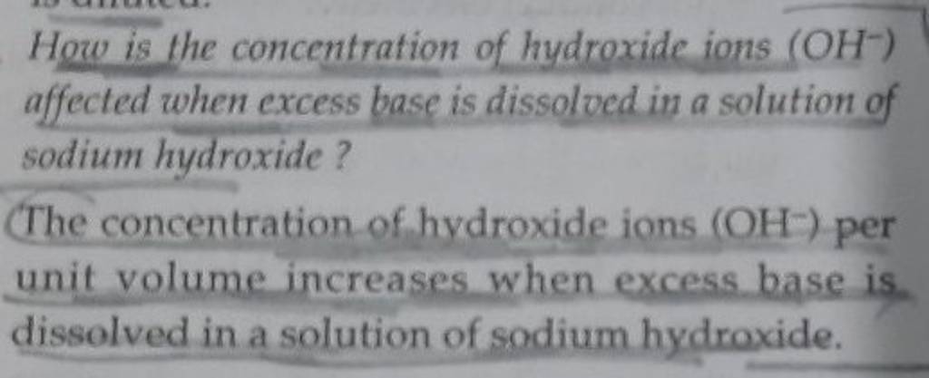 How is the concentration of hydroxide ions (OH−) affected when excess bas..