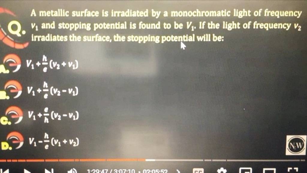 A metallic surface is irradiated by a monochromatic light of frequency v1..