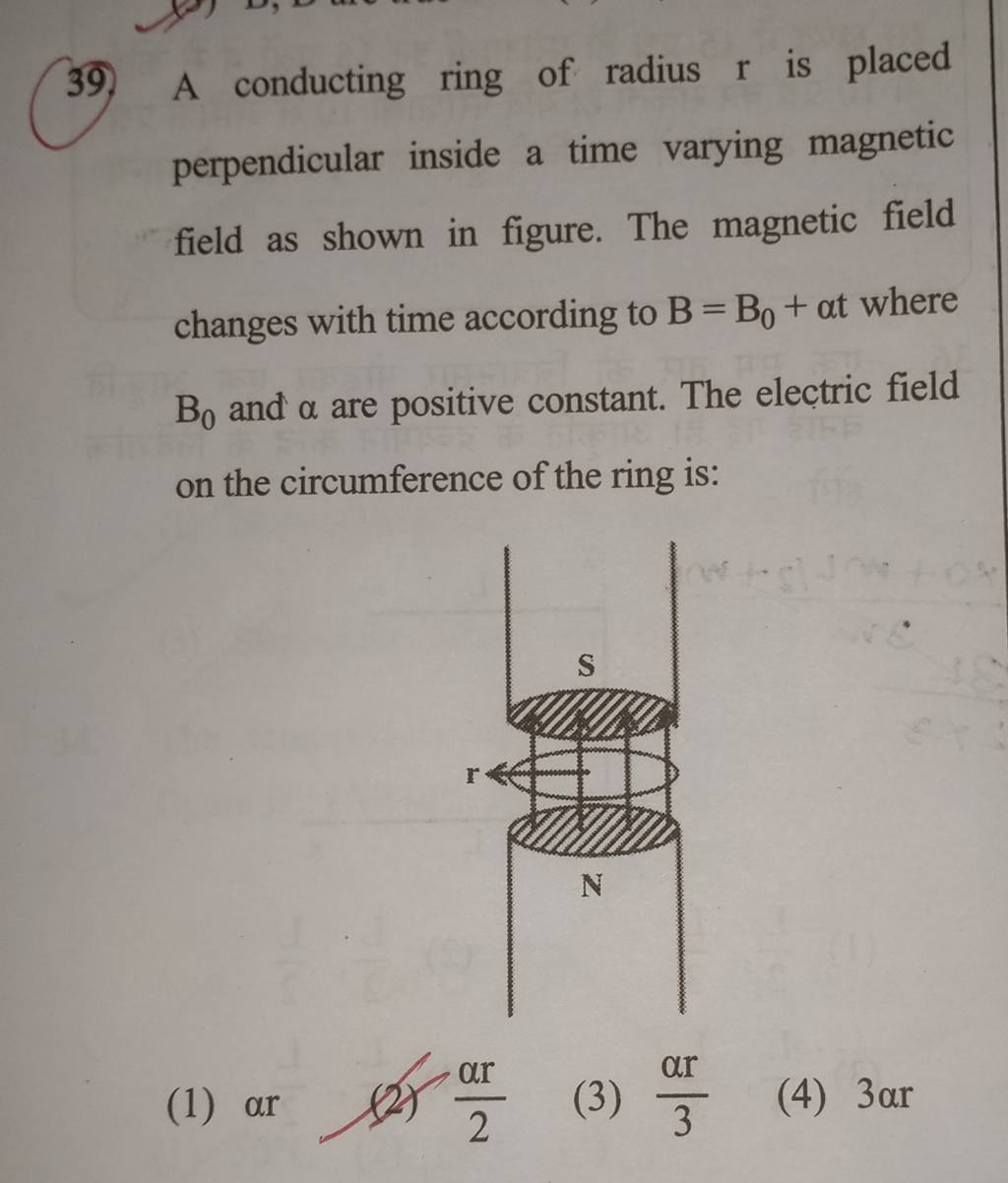 A conducting ring of radius r is placed perpendicular inside a time varyi..