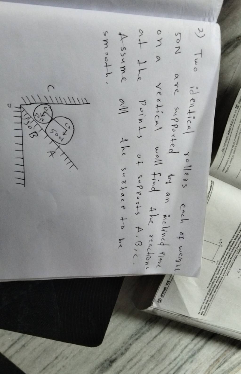 2) Two identical rollers each of weight 50 N are supported by an inclined..