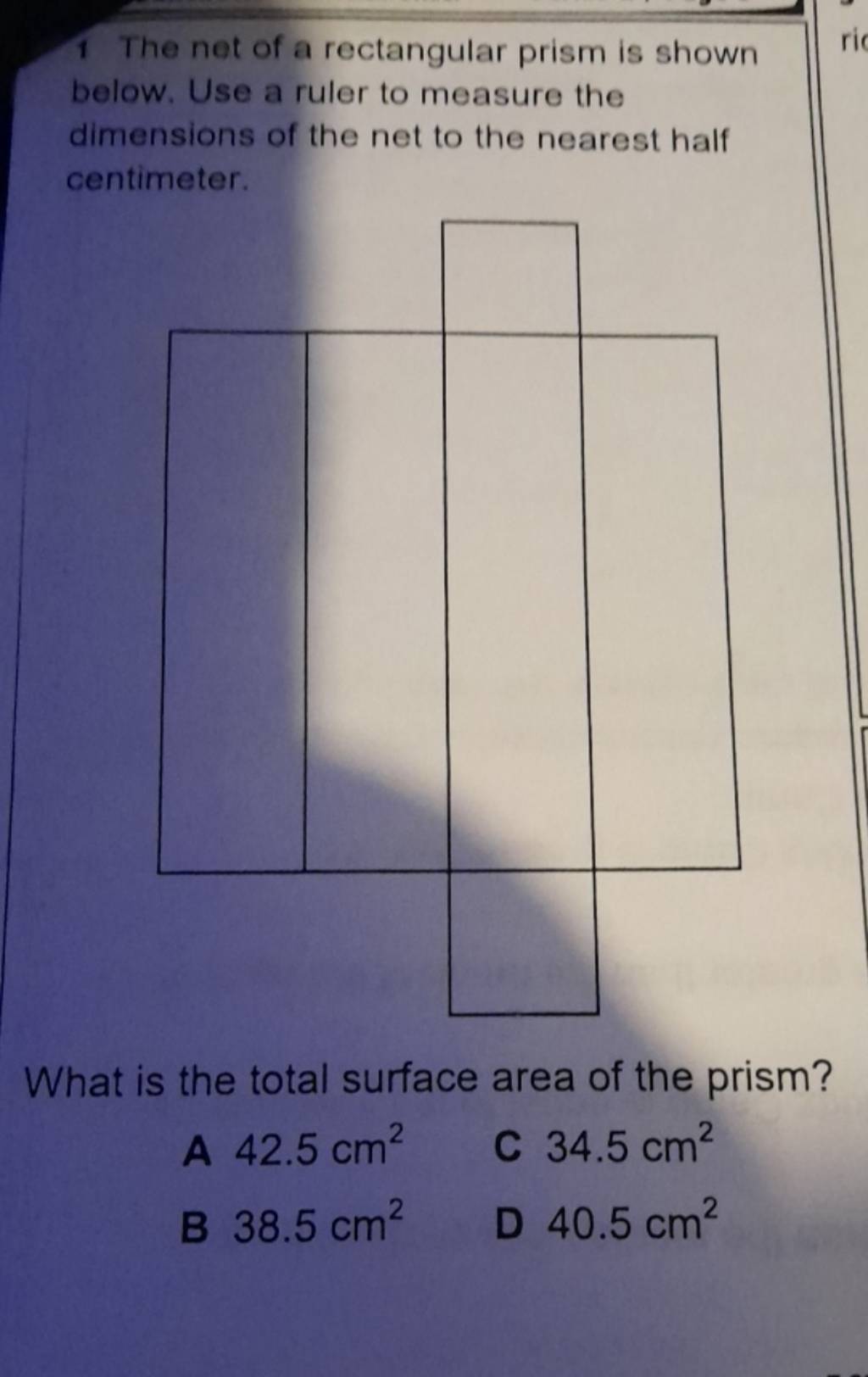 1 The net of a rectangular prism is shown below. Use a ruler to measure t..