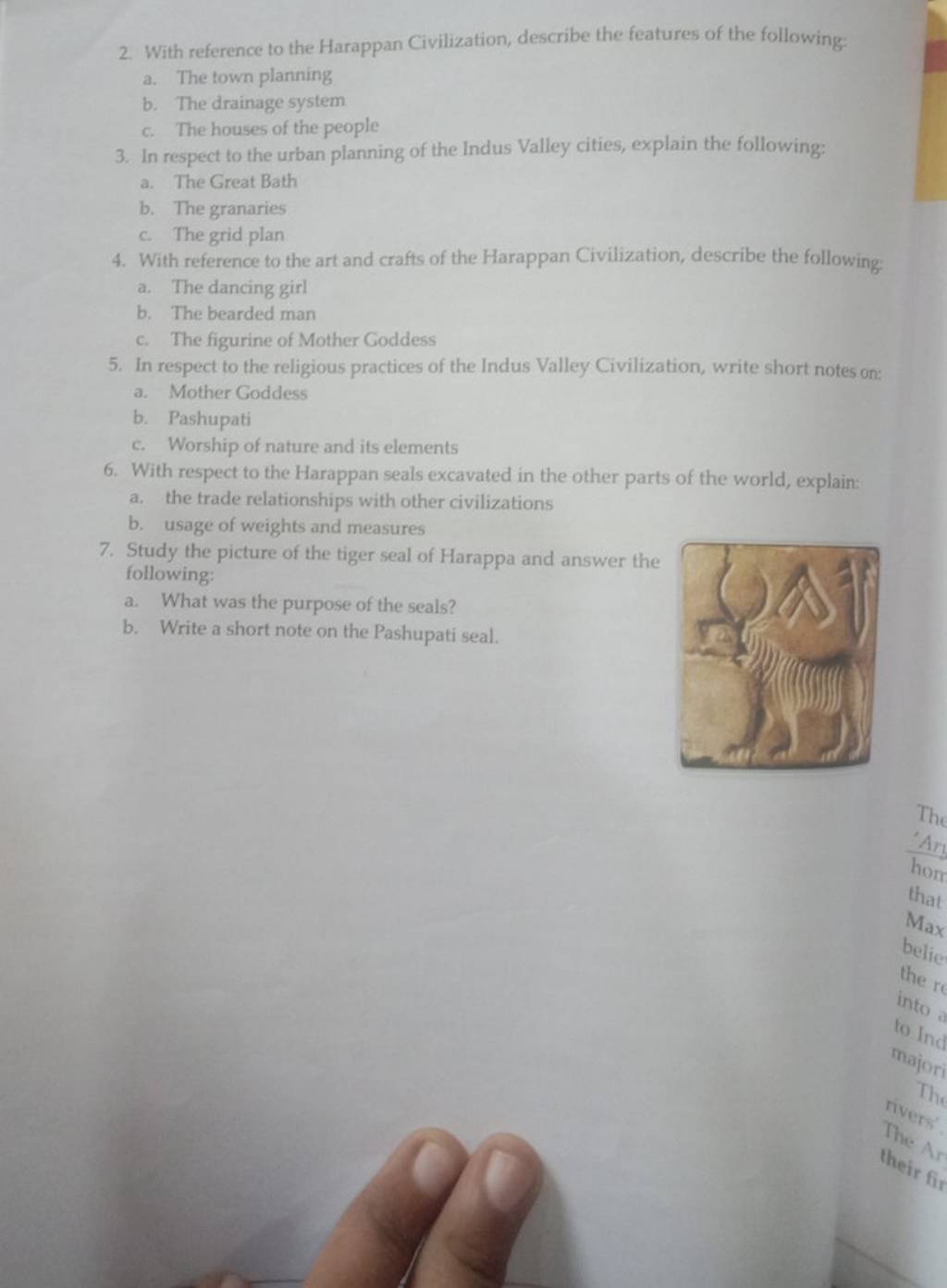 2. With reference to the Harappan Civilization, describe the features of