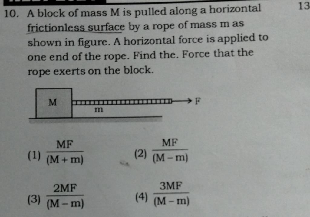 A block of mass M is pulled along a horizontal frictionless surface by a